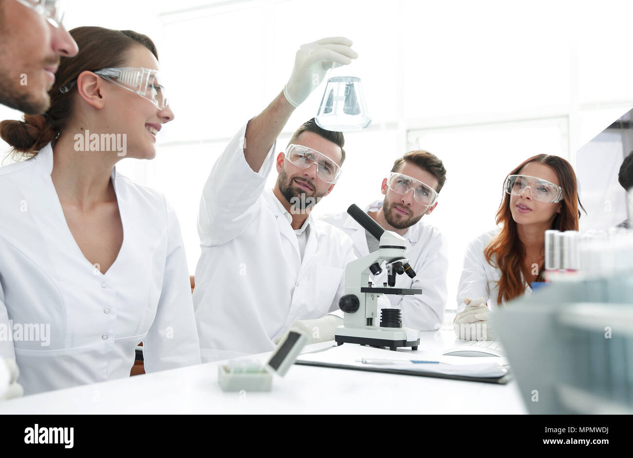 group of young workers are working in biochemistry lab Stock Photo - Alamy