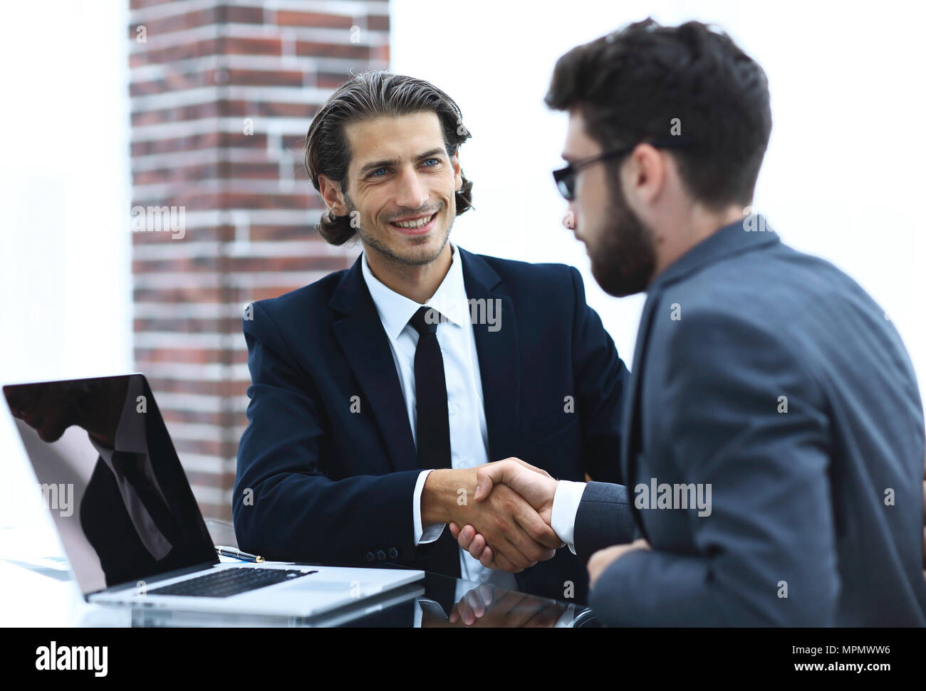 closeup. business handshake in an office Stock Photo - Alamy