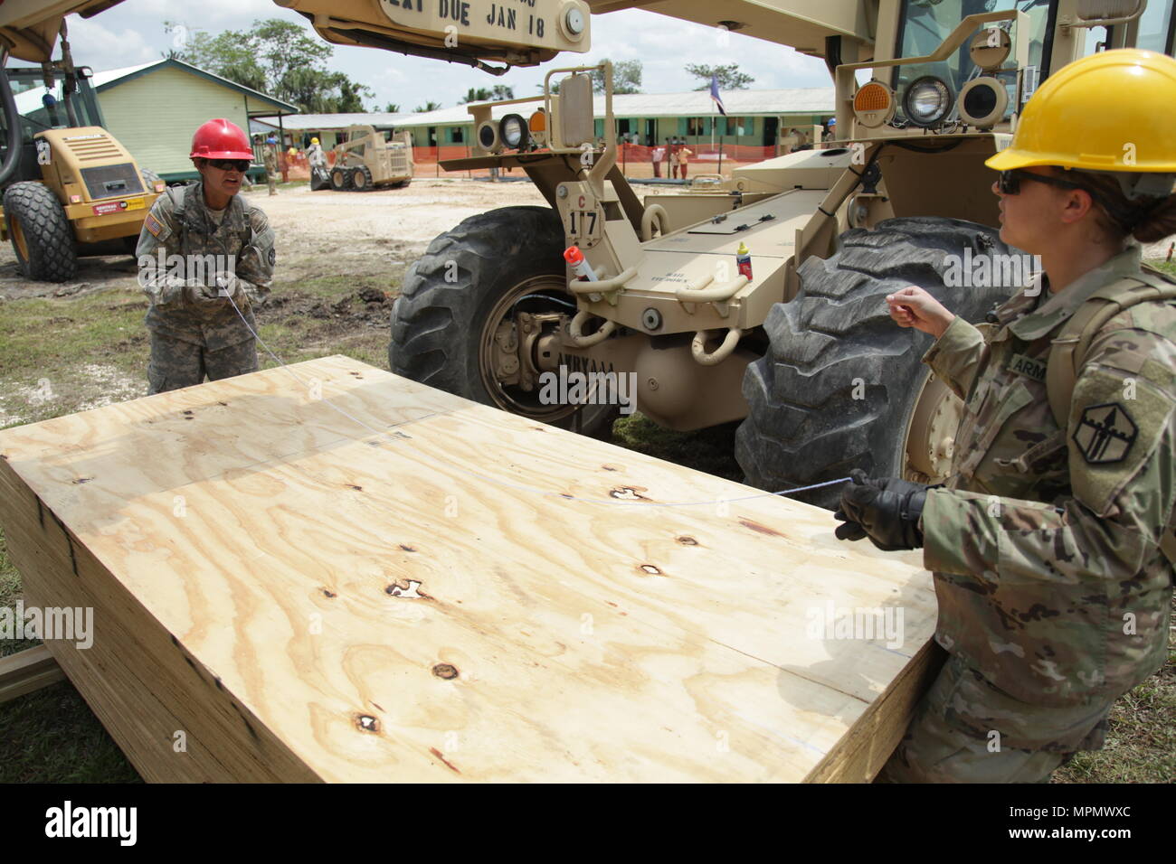 Spc. Tracy Ortiz (left), assigned to 144th Minimal Care Detachment, and ...