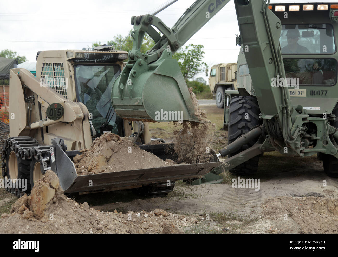 Soldiers with the 672nd Engineer Company clear out an area in ...