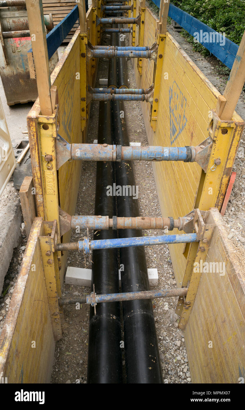Insulated plastic pipes for district heating lying on plastic supports ...