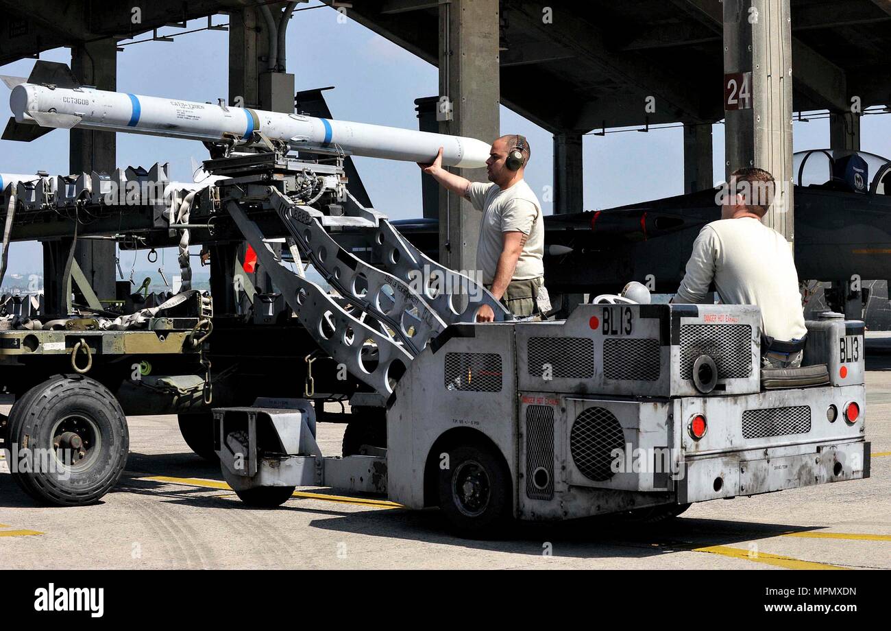 A U.S. Air Force weapons load crew team from the 44th Aircraft ...