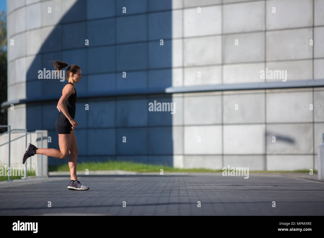 Female Urban Runner training on Concrete stairs Stock Photo - Alamy
