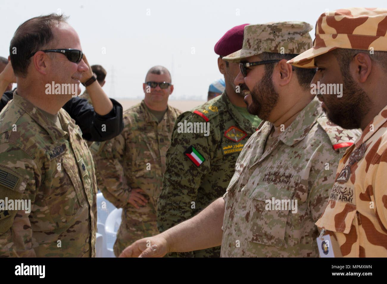 Kuwait- A large crowd of foreign and U.S. dignitaries meet to view ...
