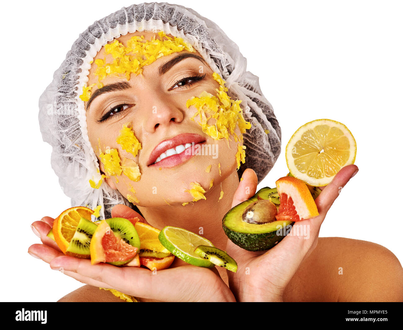 Facial mask from fruits for woman. Girl in medical hat Stock Photo - Alamy