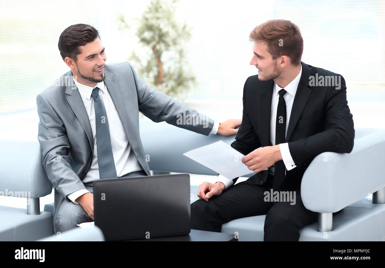 Employees talking sitting lobby hi-res stock photography and images - Alamy