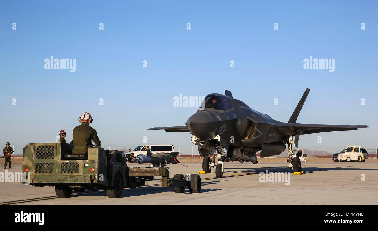 Marines with Marine Fighter Attack Squadron (VMFA) 211 prepare to ...