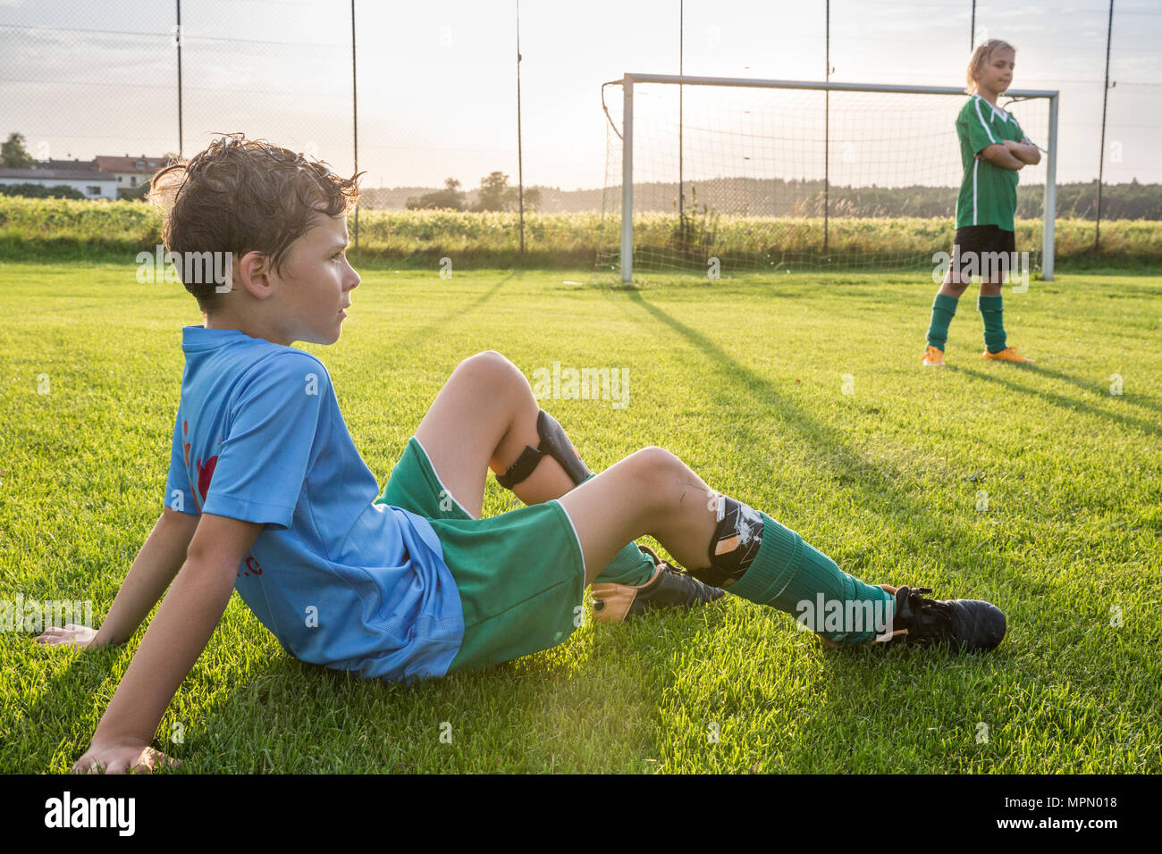 Two young football players on football ground Stock Photo - Alamy