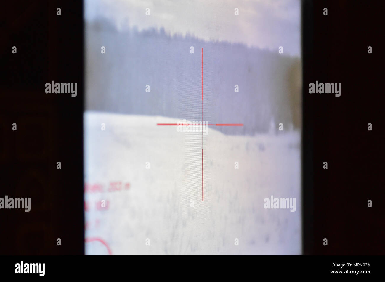 The aiming reticle is seen on a screen as Army Sgt. Mayra Haynes, a ...