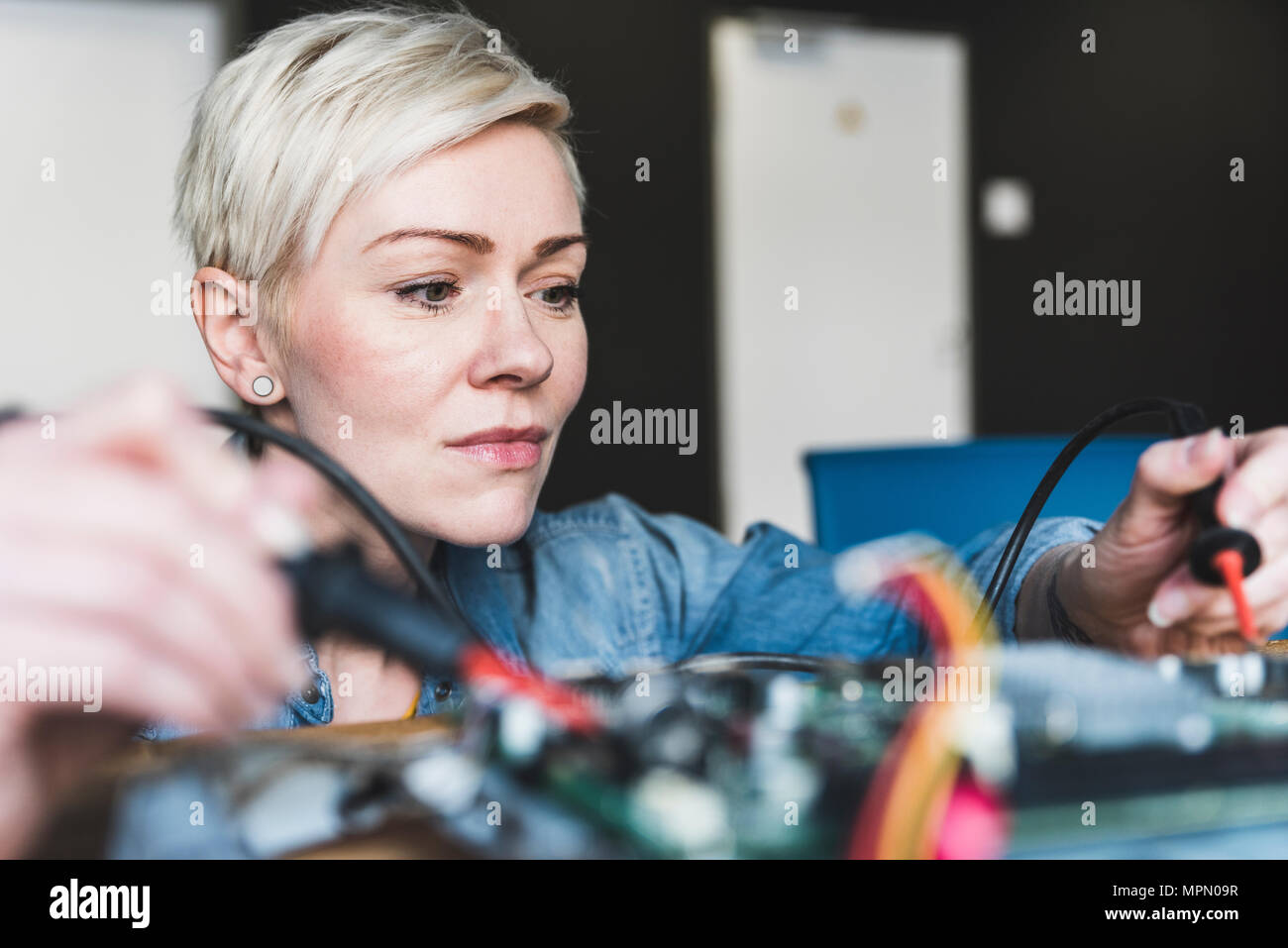 Woman working on computer equipment Stock Photo - Alamy