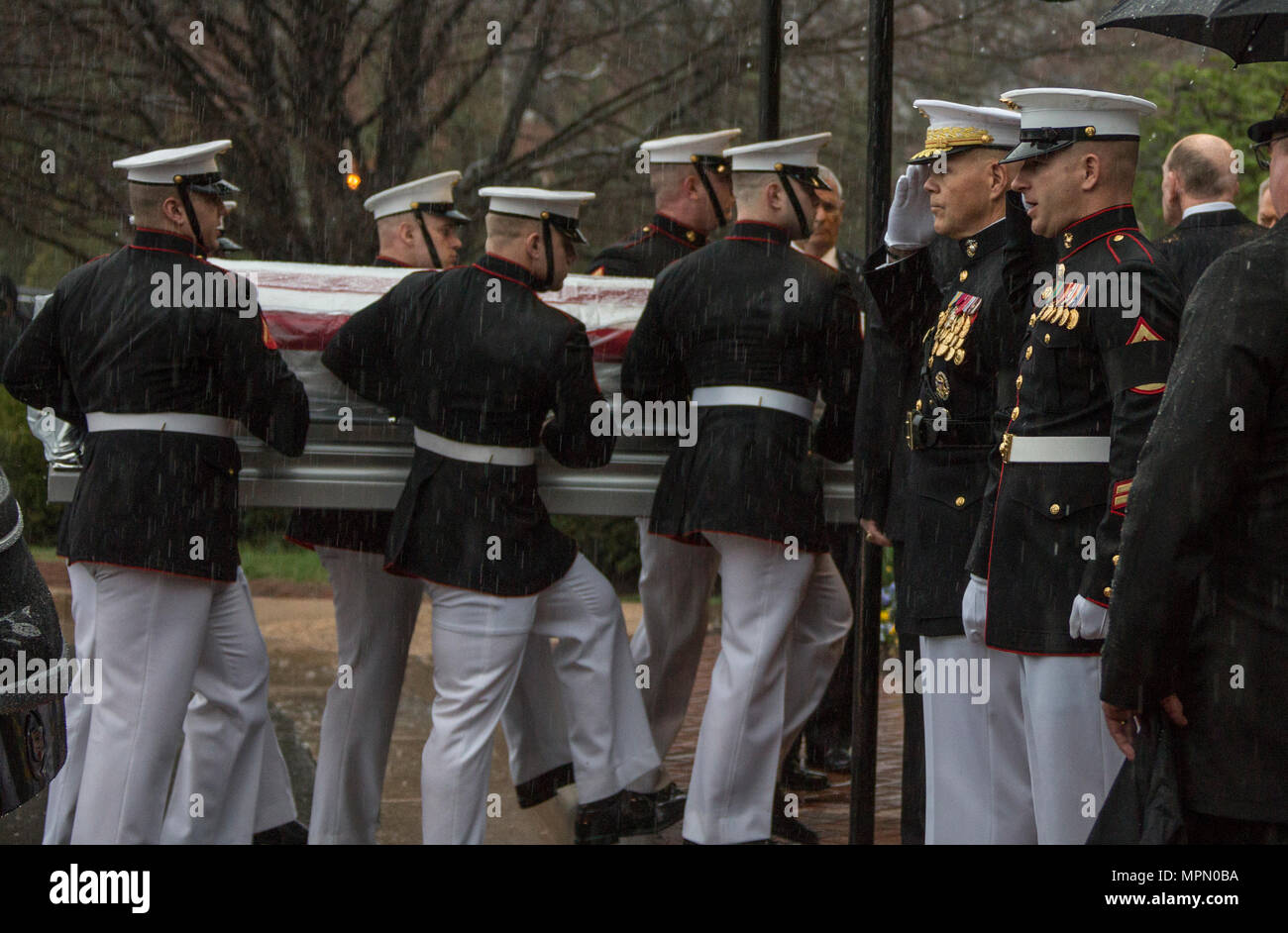 Commandant of the Marine Corps Gen. Robert B. Neller, right, salutes ...