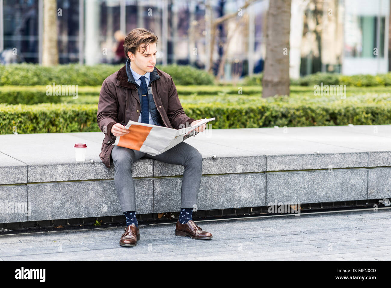 Male reading outdoors hi-res stock photography and images - Alamy
