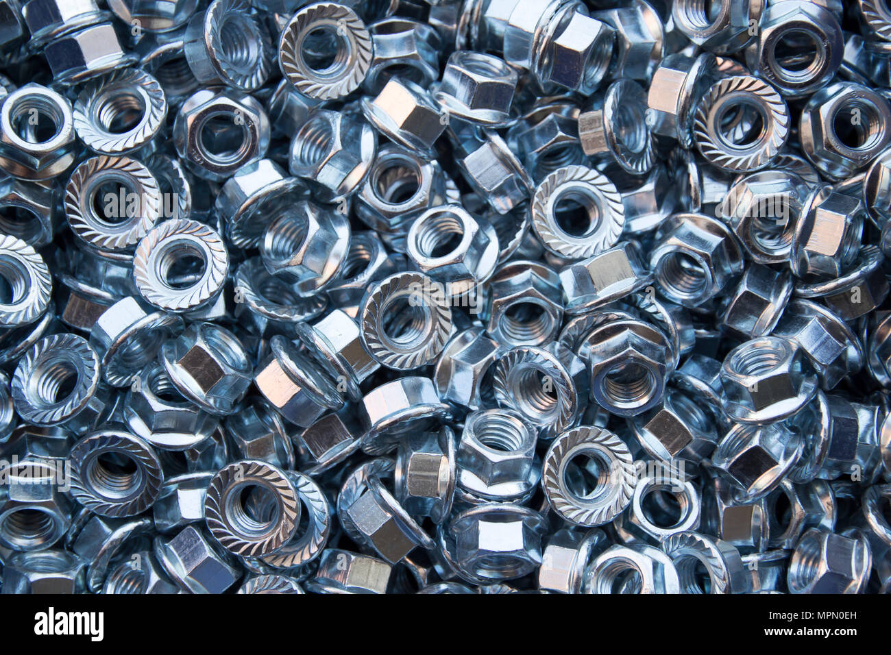 big pile of screw nuts as background Stock Photo - Alamy
