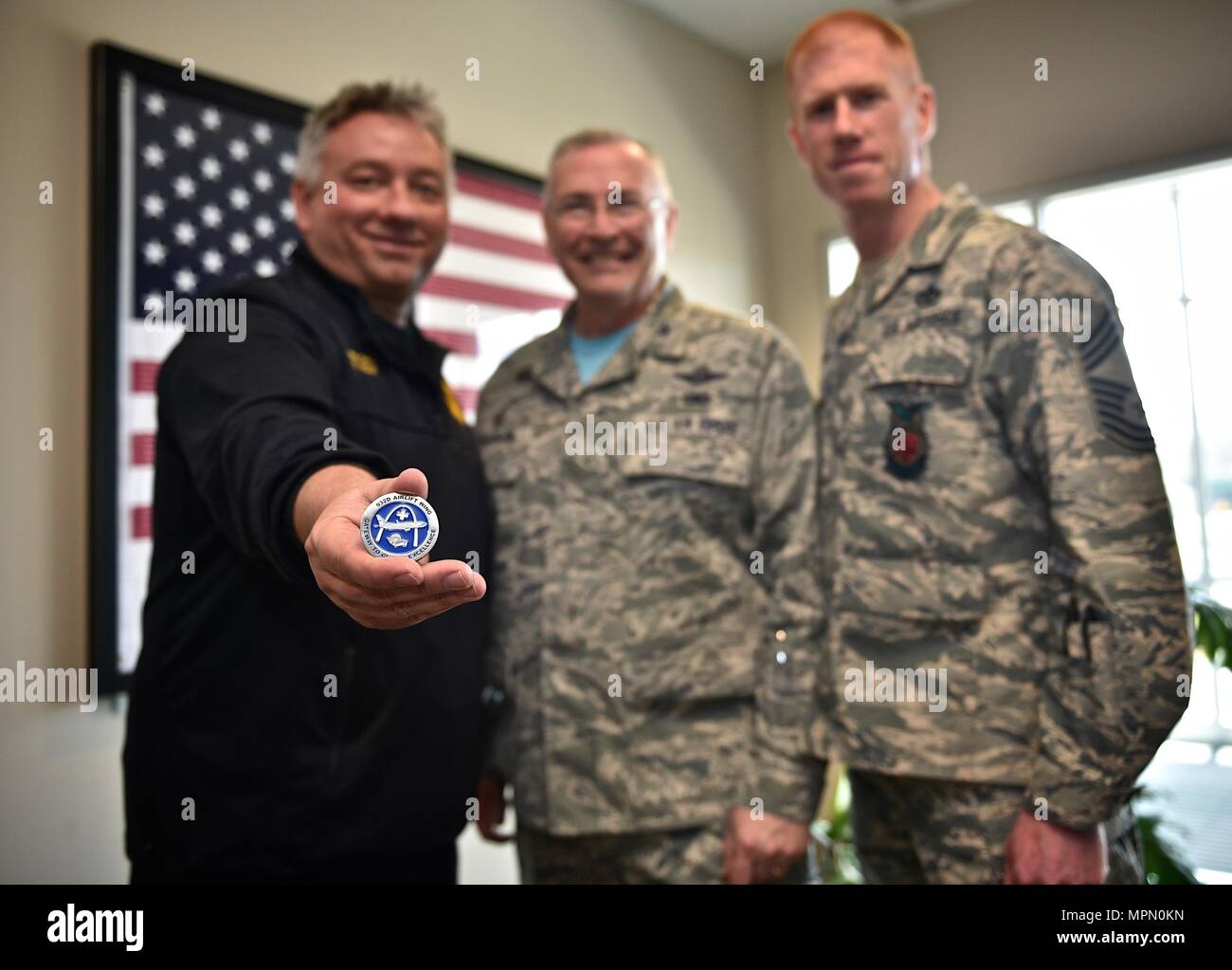 Tom Pour, Belleville Fire Department fire chief, holds a 932nd Wing ...