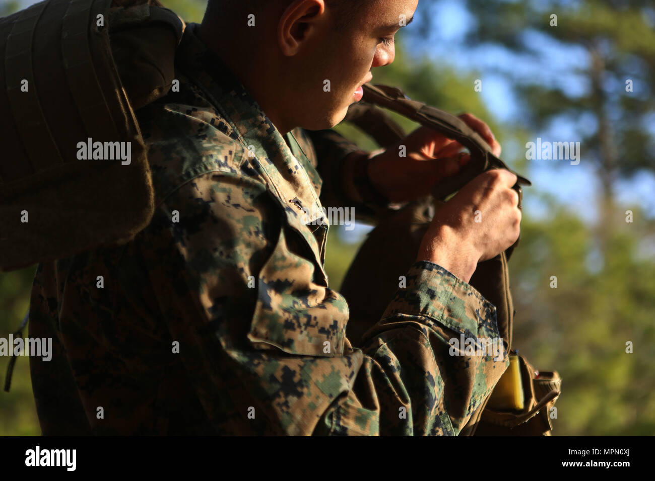 A U.S. Marine, with Headquarters Regiment, 2nd Marine Logistics Group ...