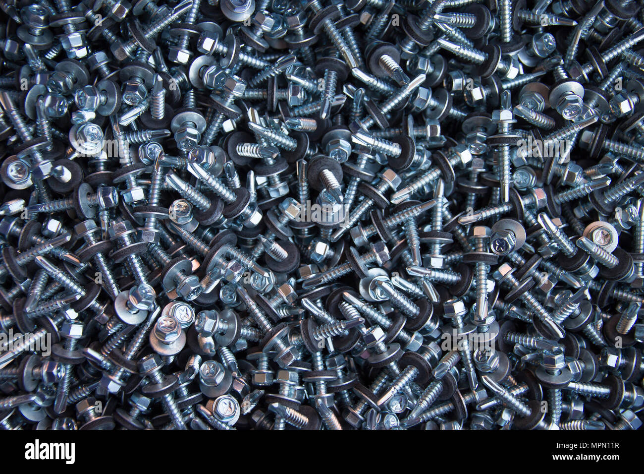 Many Metal bolts with washer closeup Stock Photo - Alamy