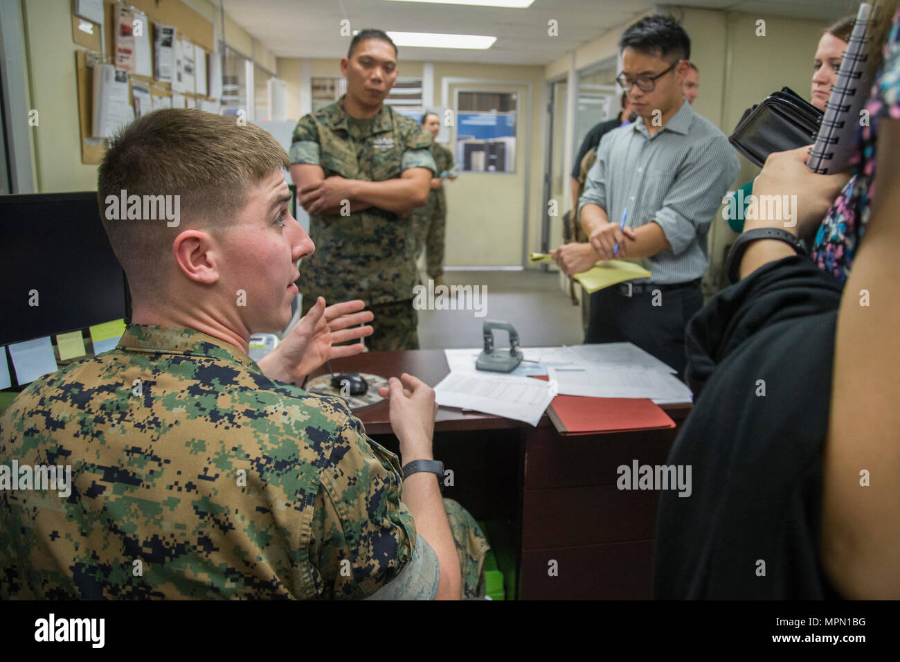 U.S. Marine Corps Lance Cpl. Christian Jacobs, procurement clerk, left ...