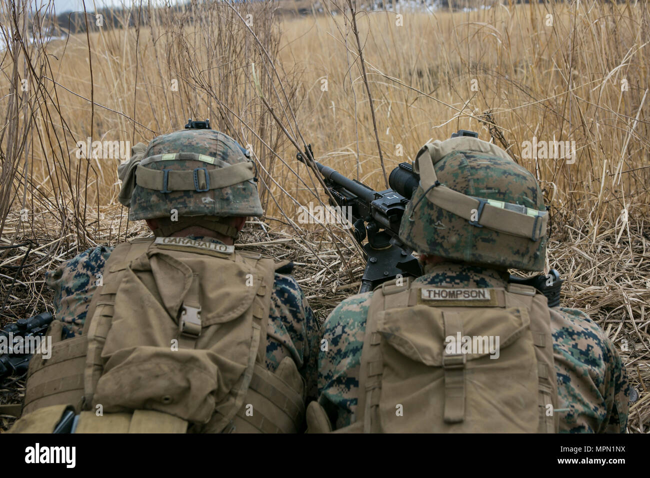 U.S. Marines Lance Cpl. Jose Caraballo, left, and Cpl. Jourdan Thompson ...