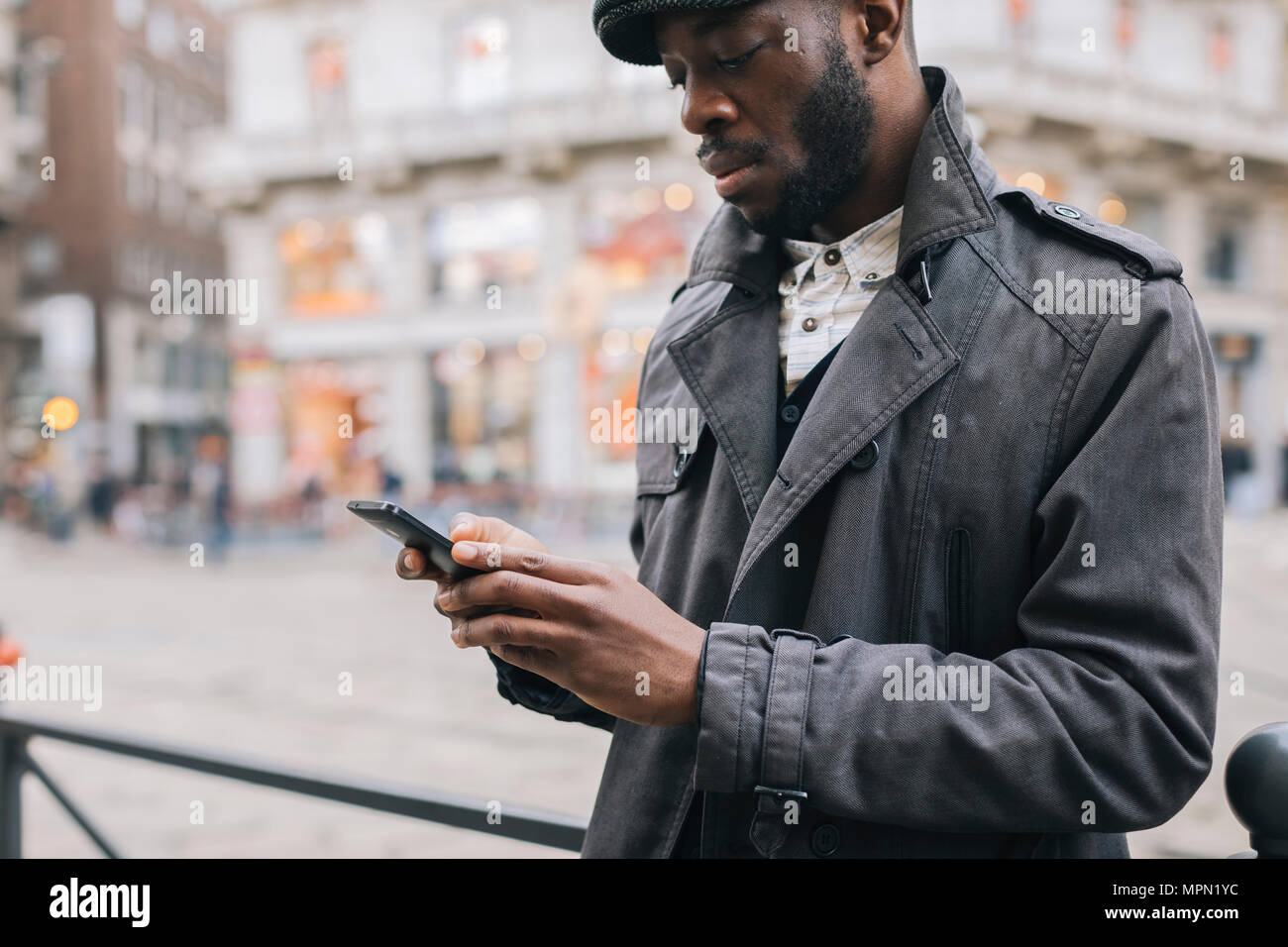 Commuters checking cell phones hi-res stock photography and images - Alamy