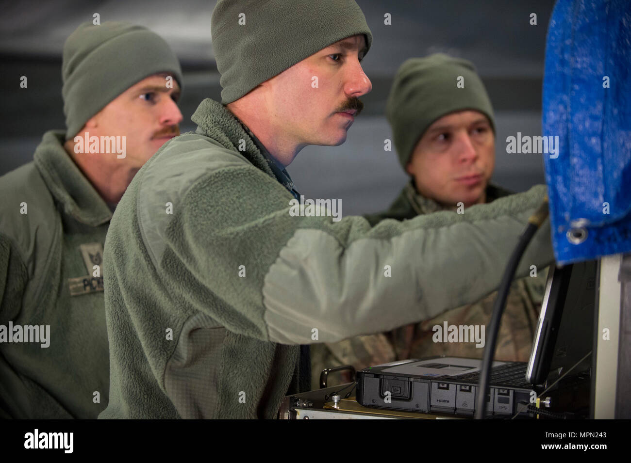 Staff Sgt. John Holm, center, Tech. Sgt. Jesse Pickrell, left, and Tech ...
