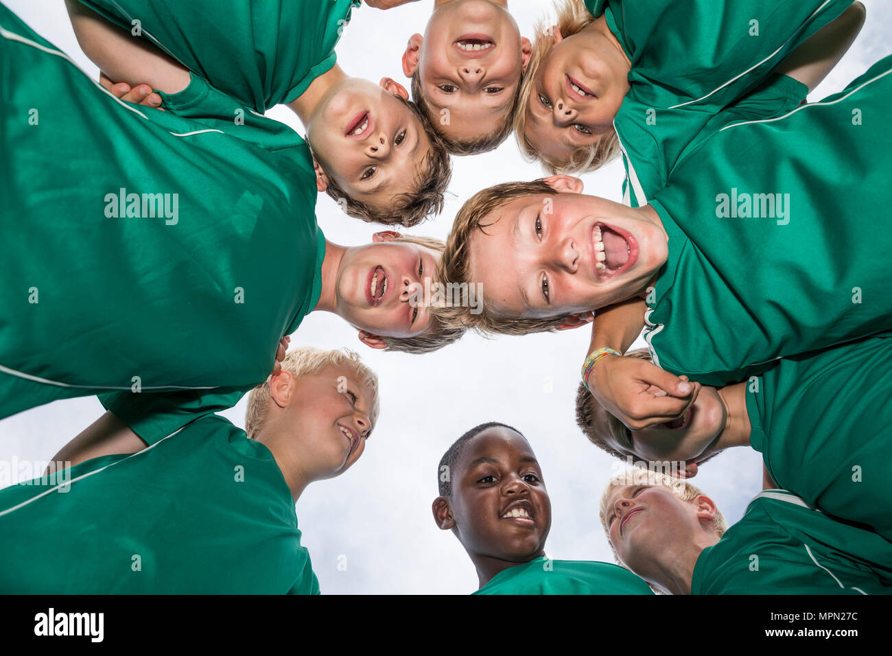 Happy kids huddle hi-res stock photography and images - Alamy
