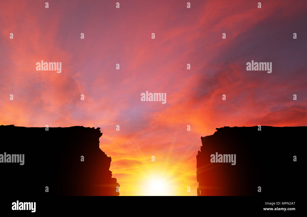Background of dramatic sunset or sunrise in between two cliff ...