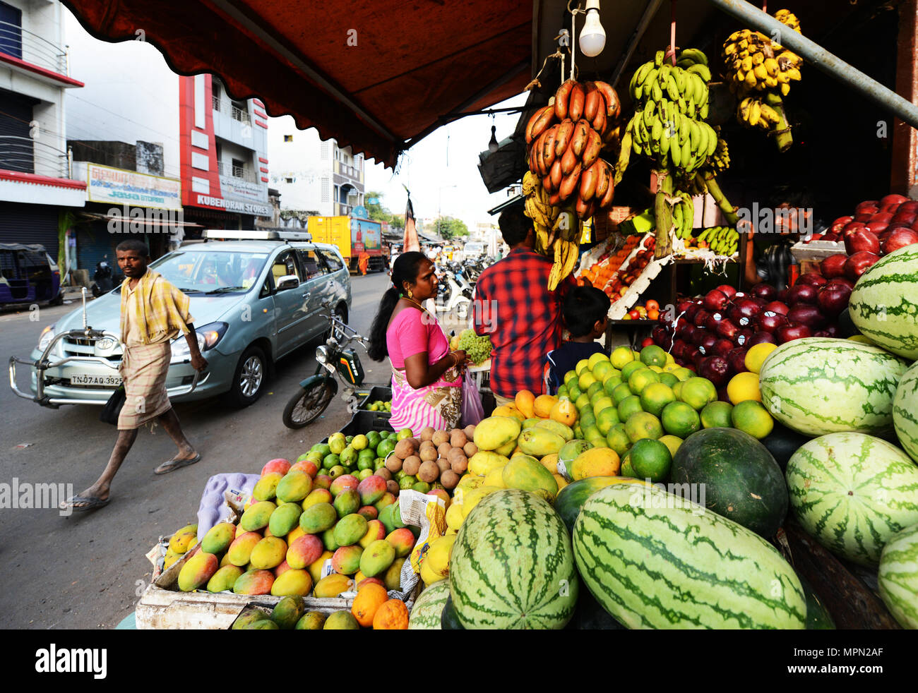 A colorful fruit stall at a vibrant market in Chennai, India Stock ...