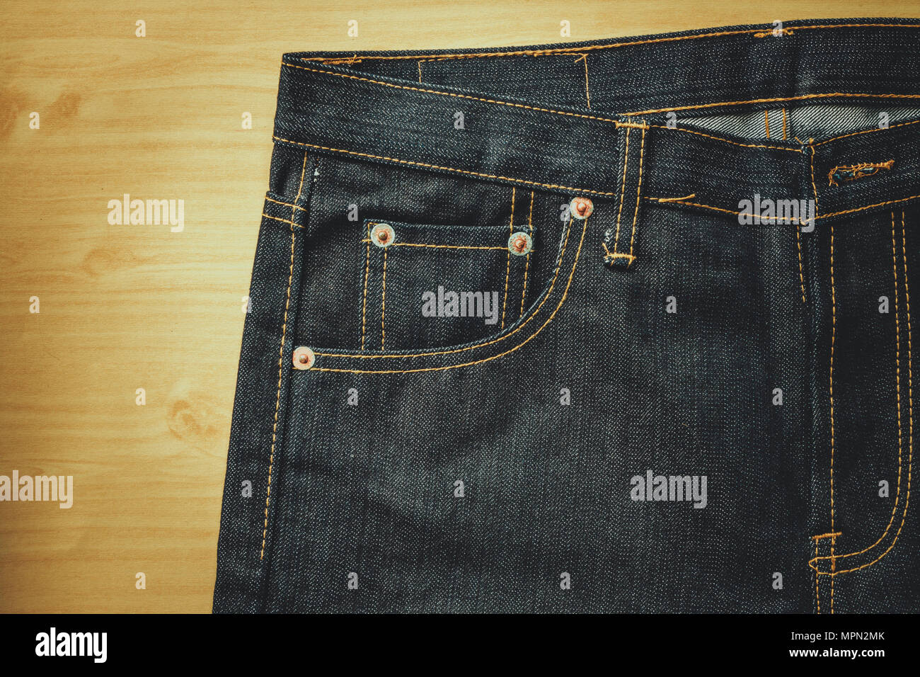 Folded denim on floor hi-res stock photography and images - Alamy