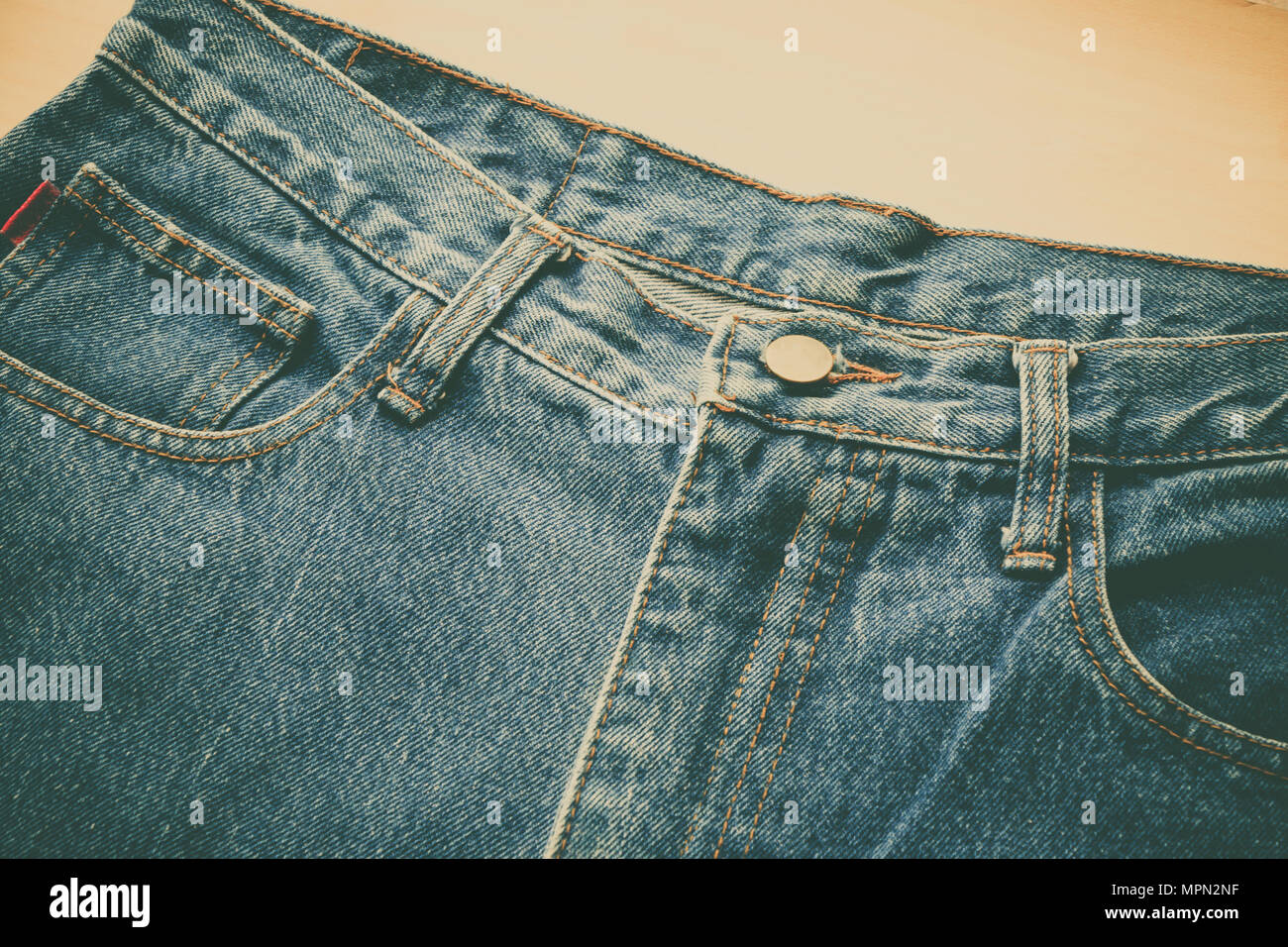 Folded denim on floor hi-res stock photography and images - Alamy