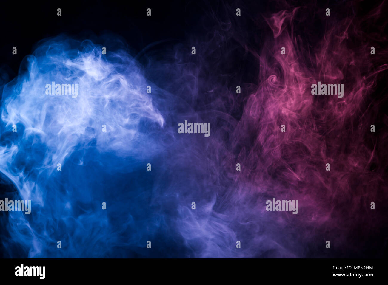 Colorful pink and blue smoke on a black isolated background. Background ...
