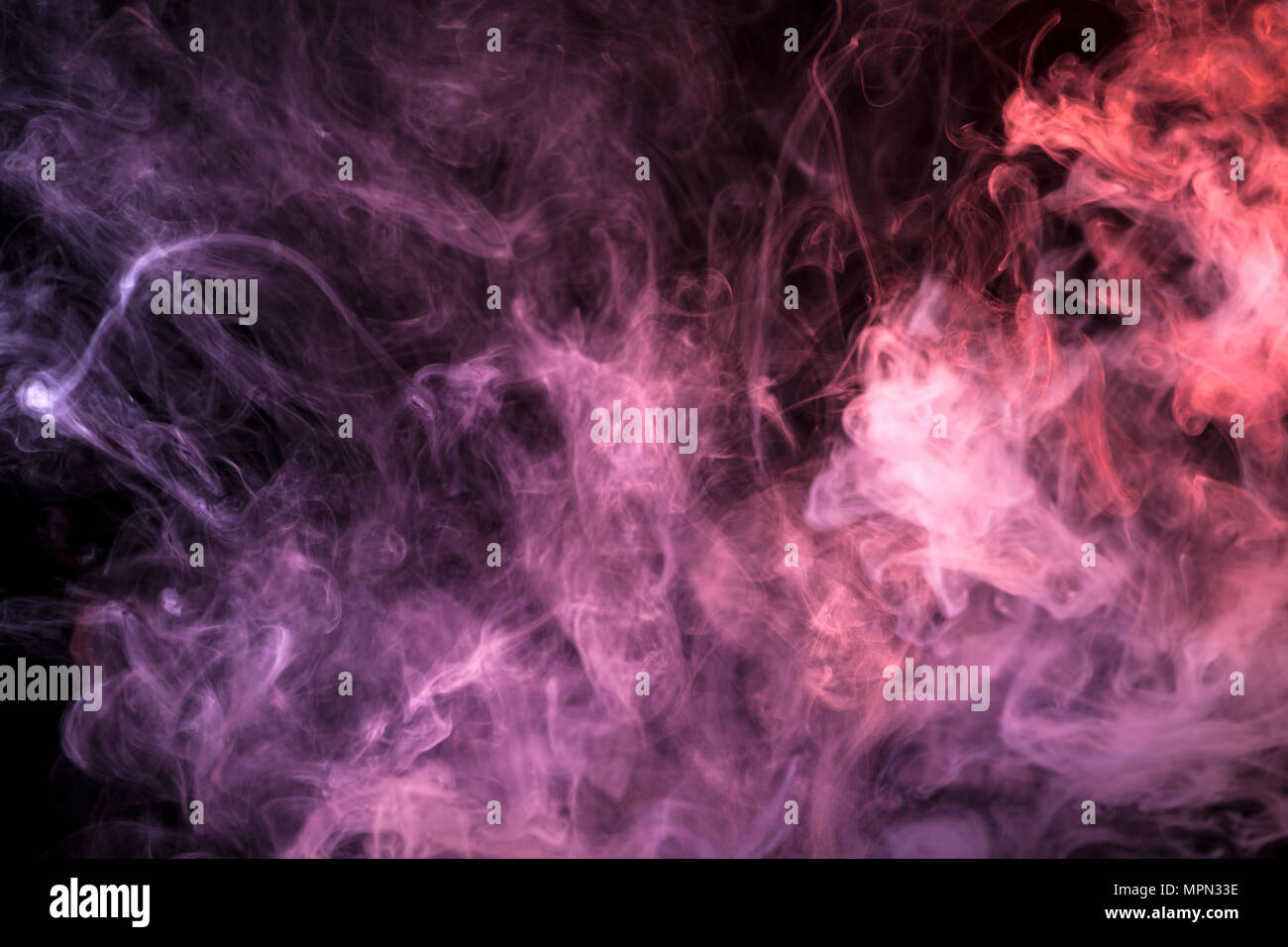 Cloud of red and pink smoke on a black isolated background. Background ...
