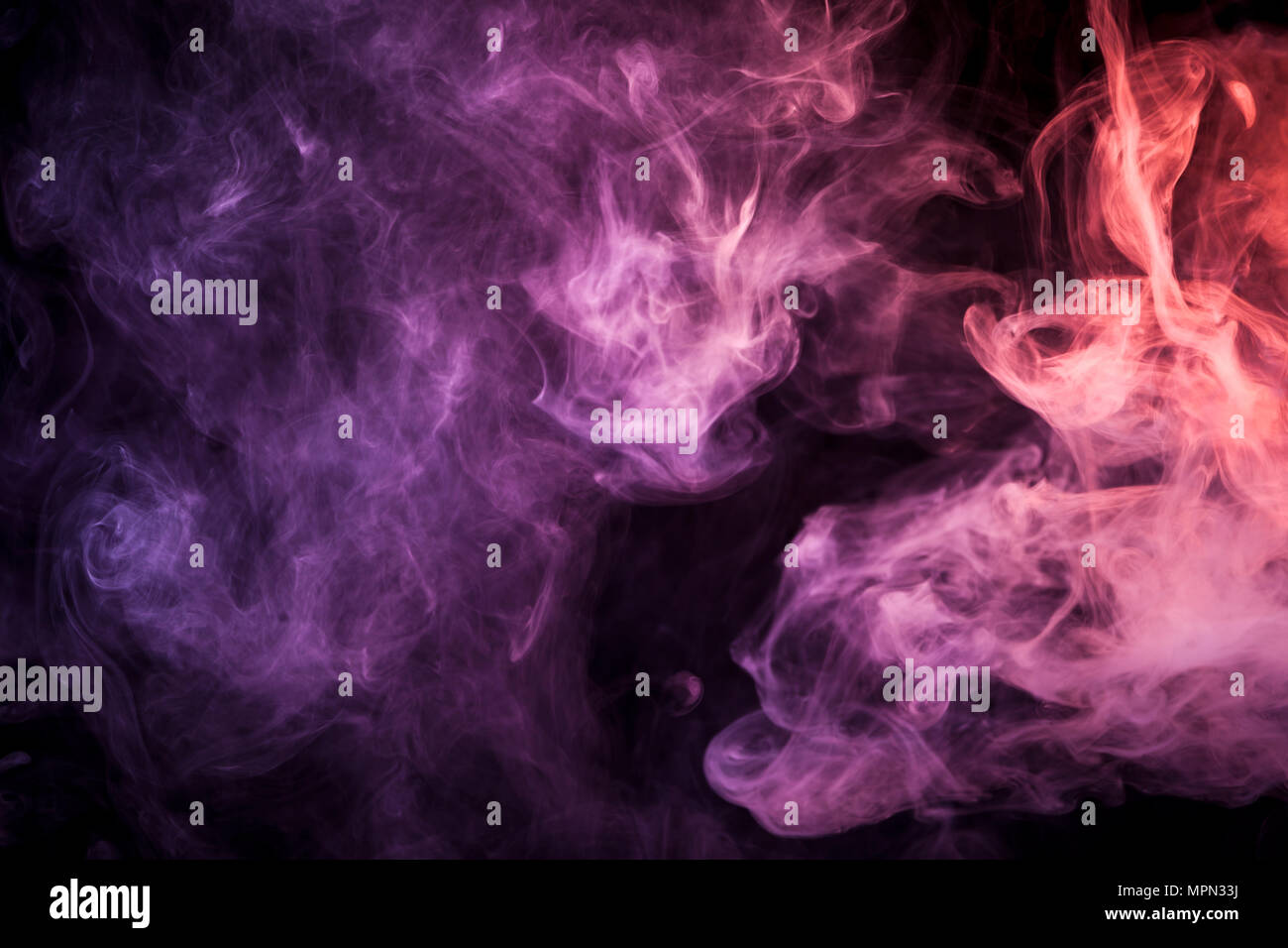 Cloud of red and pink smoke on a black isolated background. Background ...