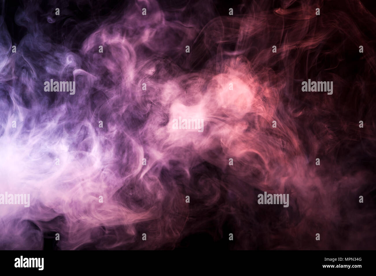 Cloud of red and pink smoke on a black isolated background. Background ...