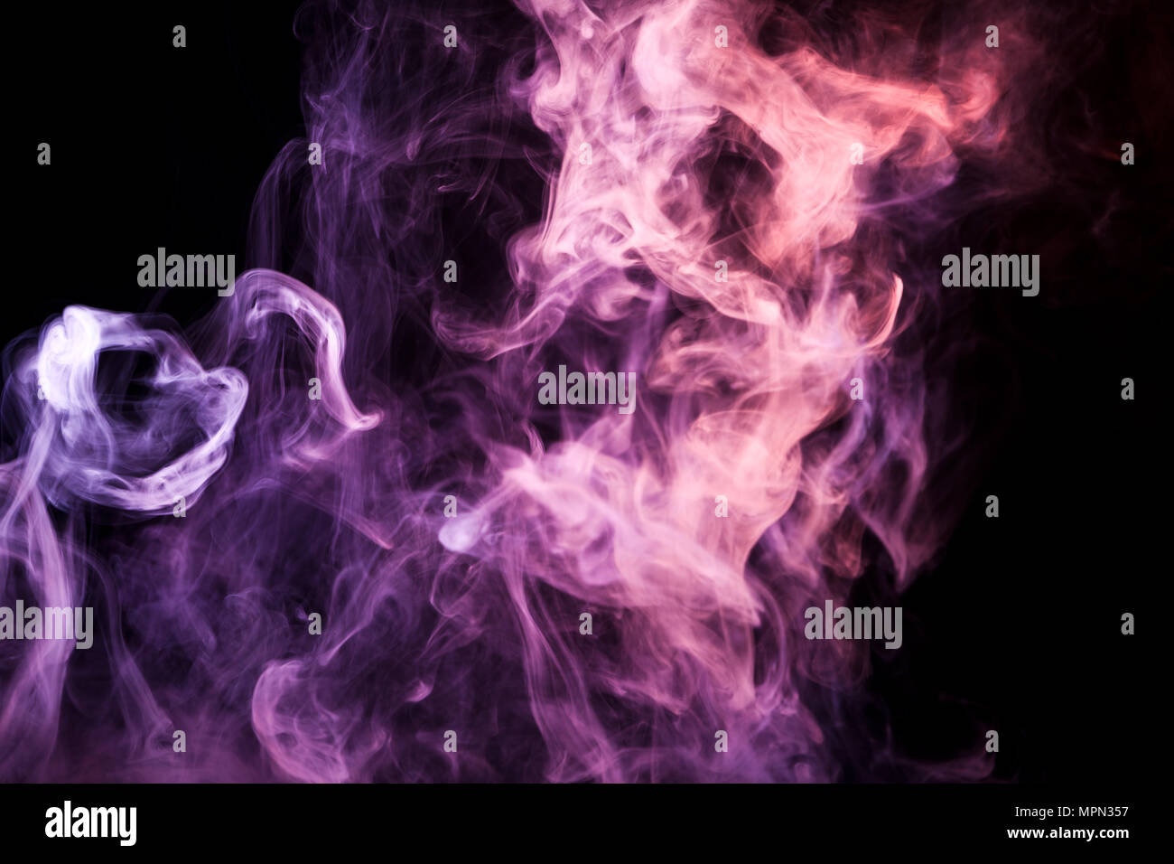 Cloud of red and pink smoke on a black isolated background. Background ...