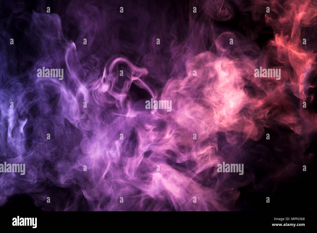 Cloud of red and pink smoke on a black isolated background. Background ...