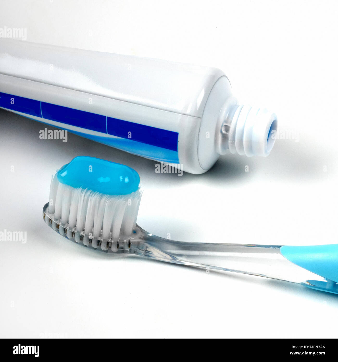 a toothbrush and a toothpaste on white background Stock Photo - Alamy