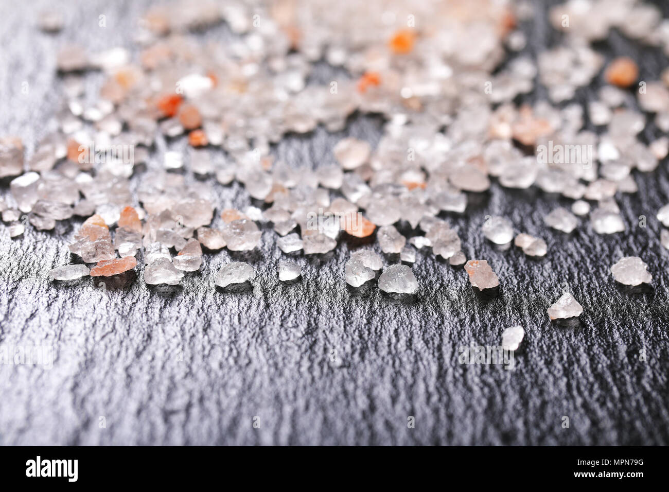 crystals of coarse grained salt on black background - detail Stock ...