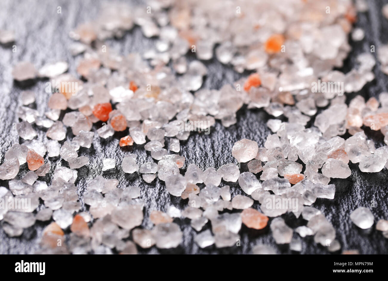 crystals of coarse grained salt on black background - detail Stock ...