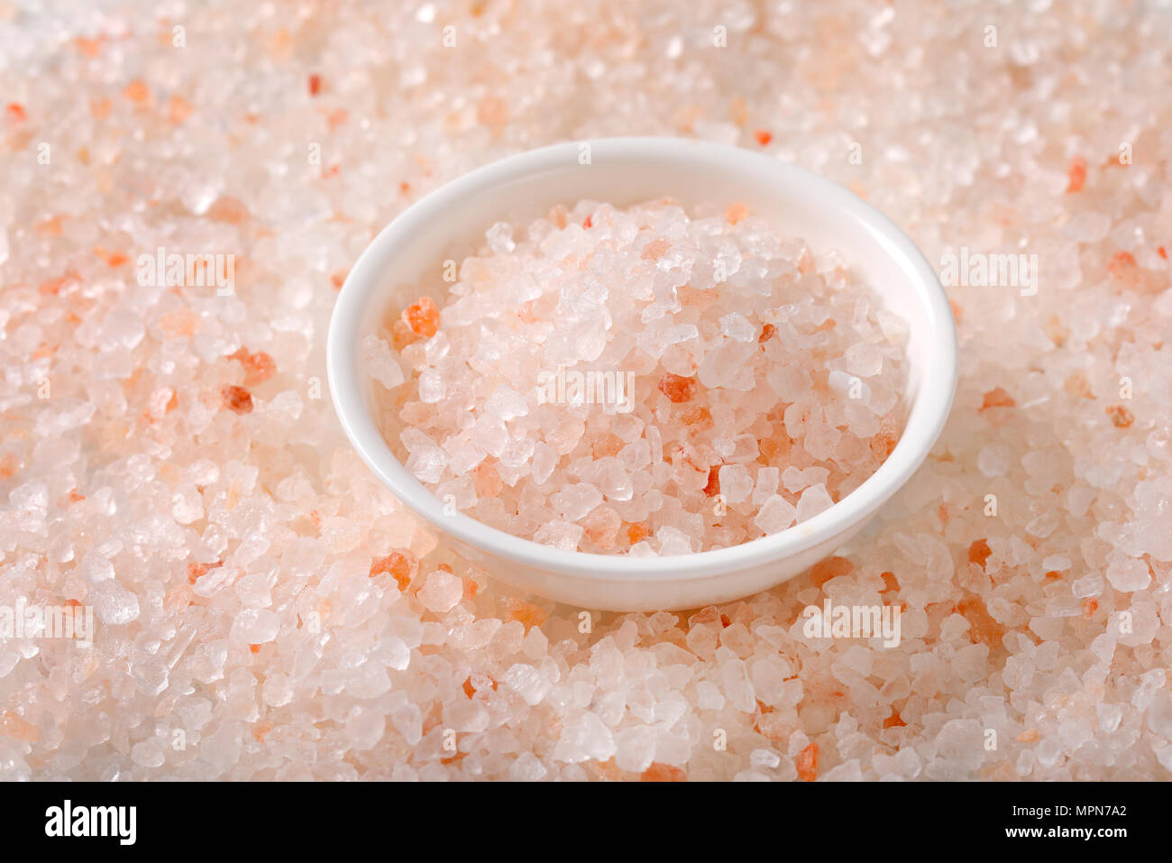 bowl of coarse grained salt on coarse grained salt background Stock ...