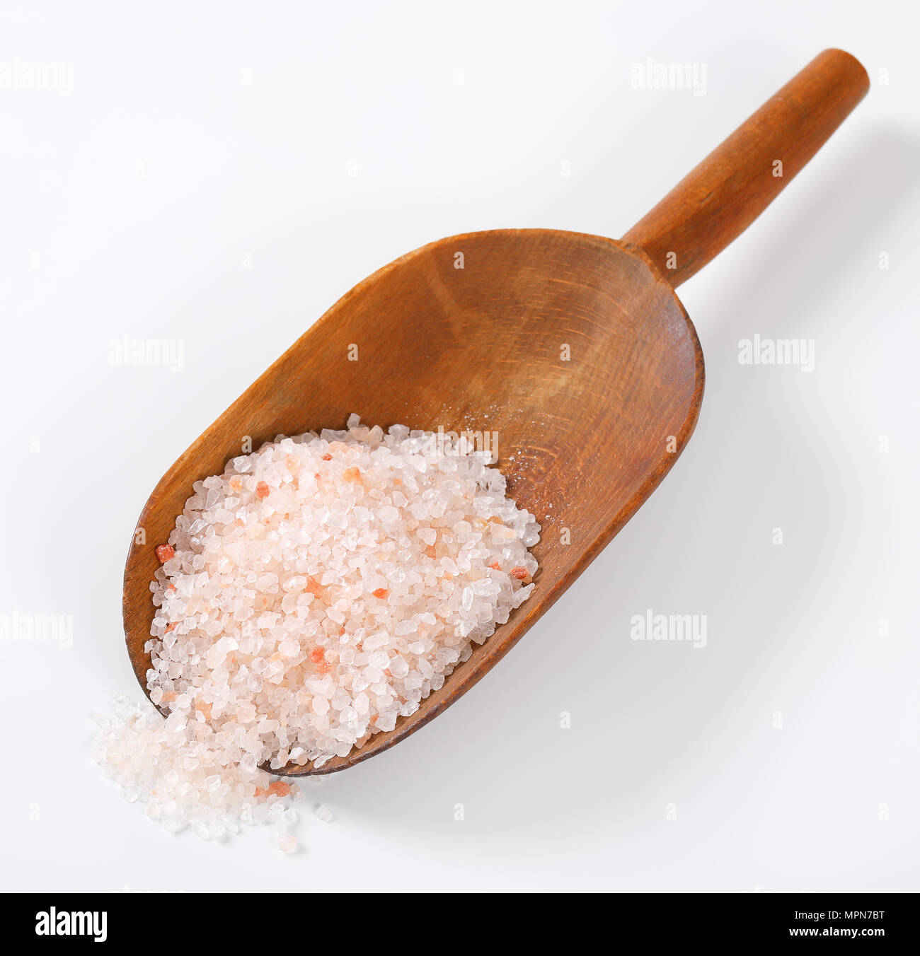 scoop of coarse grained salt on white background Stock Photo - Alamy