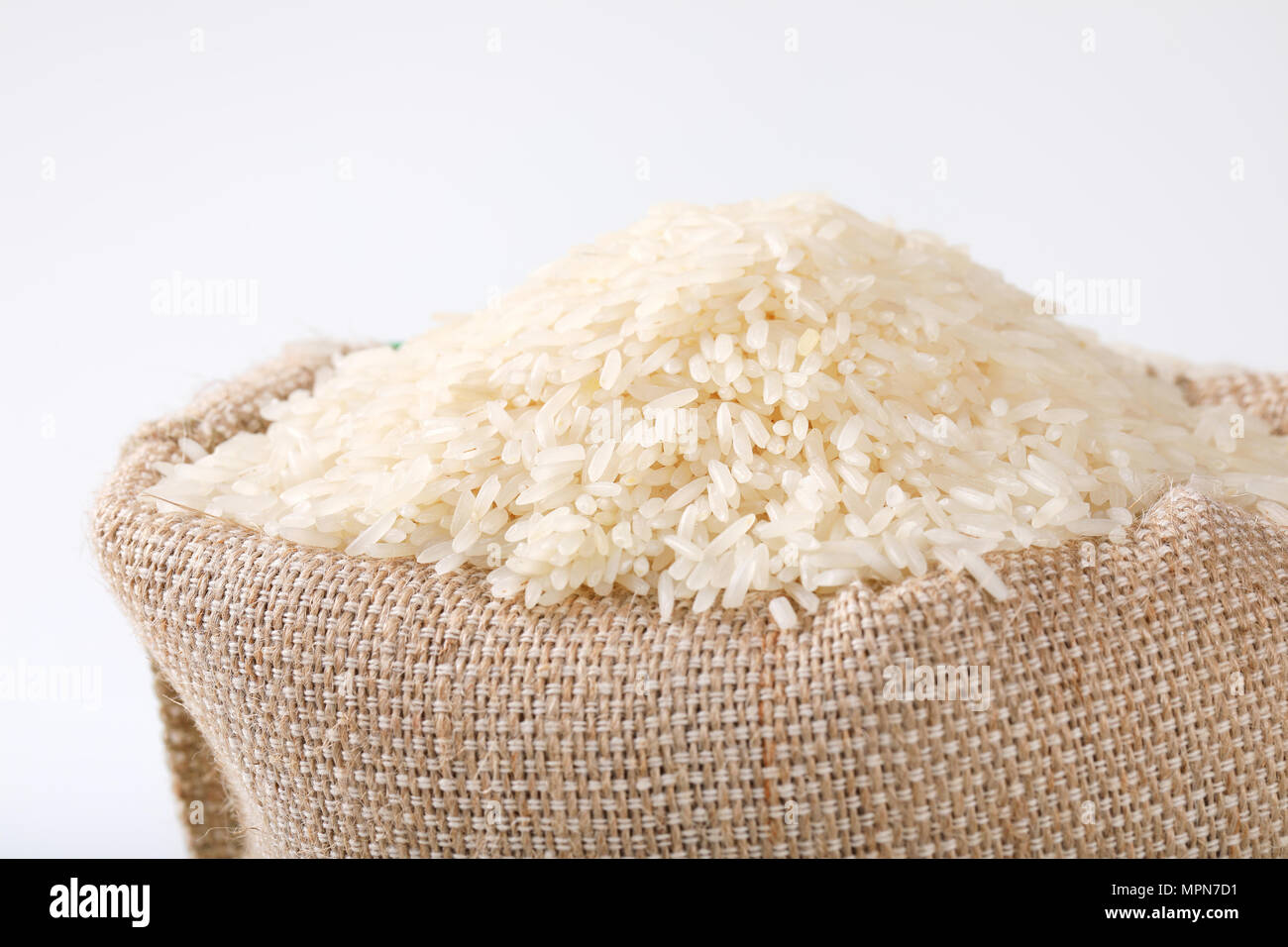 bag full of white long grained rice - close up Stock Photo - Alamy
