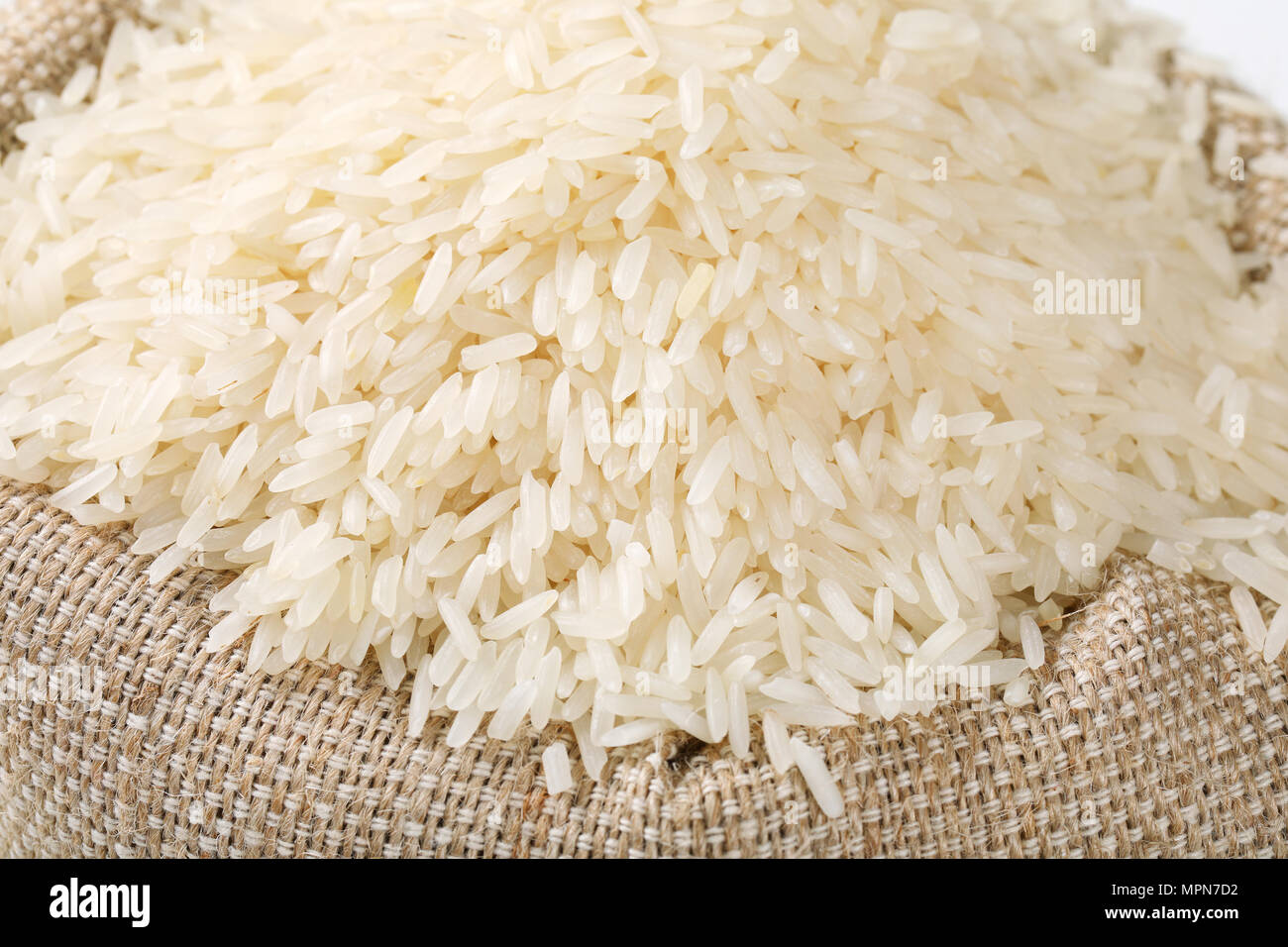 bag full of white long grained rice - detail Stock Photo - Alamy