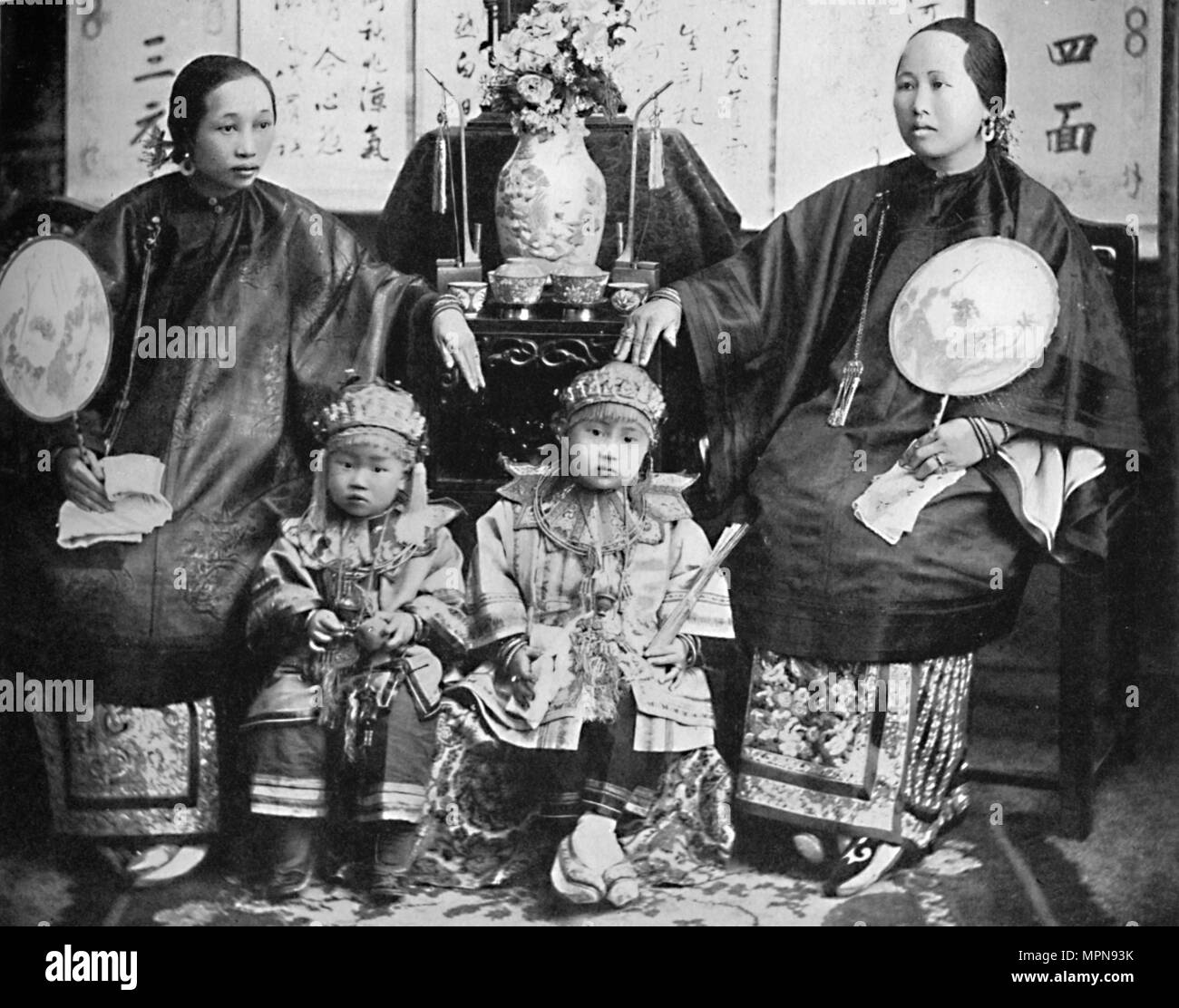A family group of a prosperous Chinese merchant, 1902. Artist: CC ...