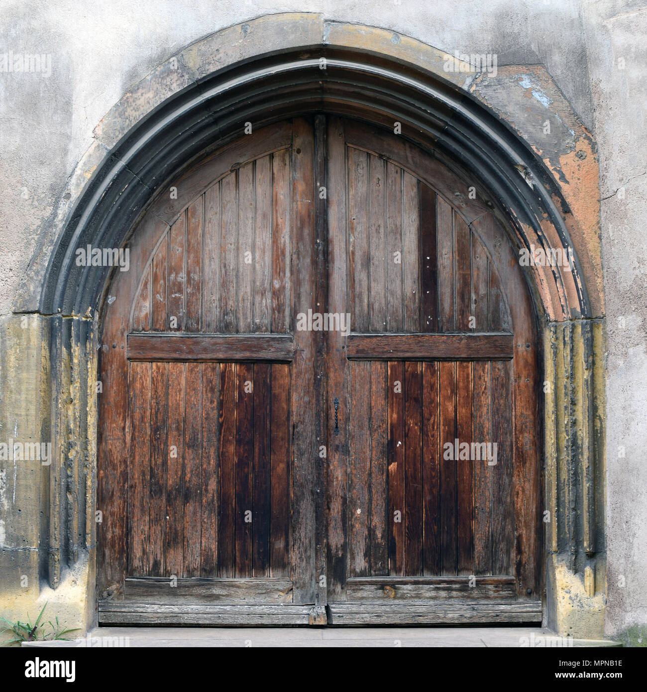 Massive old weathered wooden door Stock Photo - Alamy