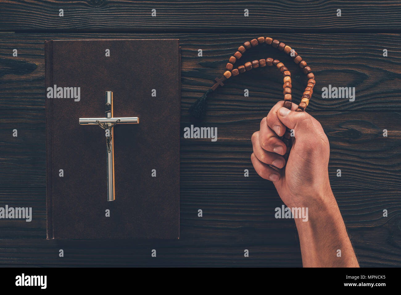 Hand holding holy bible hi-res stock photography and images - Alamy