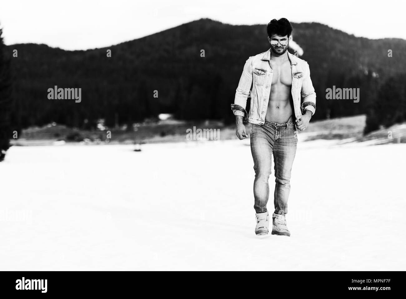 Healthy Young Man Standing Strong Flexing Muscles While Wearing Blue ...