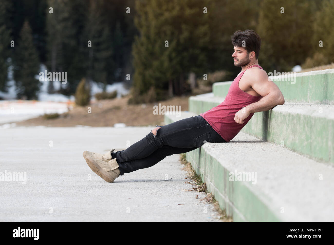 Portrait of a Young Physically Fit Man Showing His Well Trained Body ...