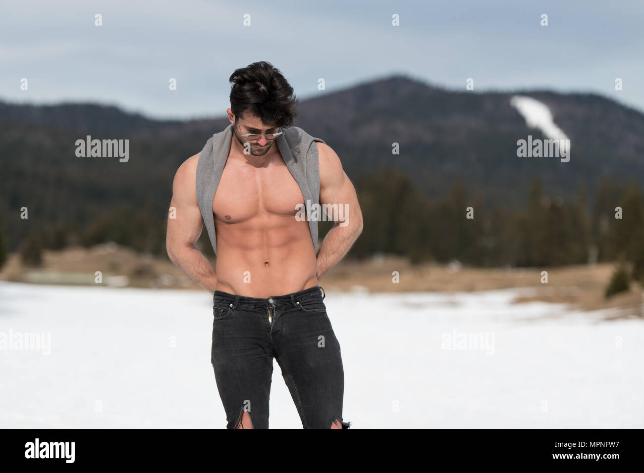 Portrait of a Young Physically Fit Man Showing His Well Trained Body ...