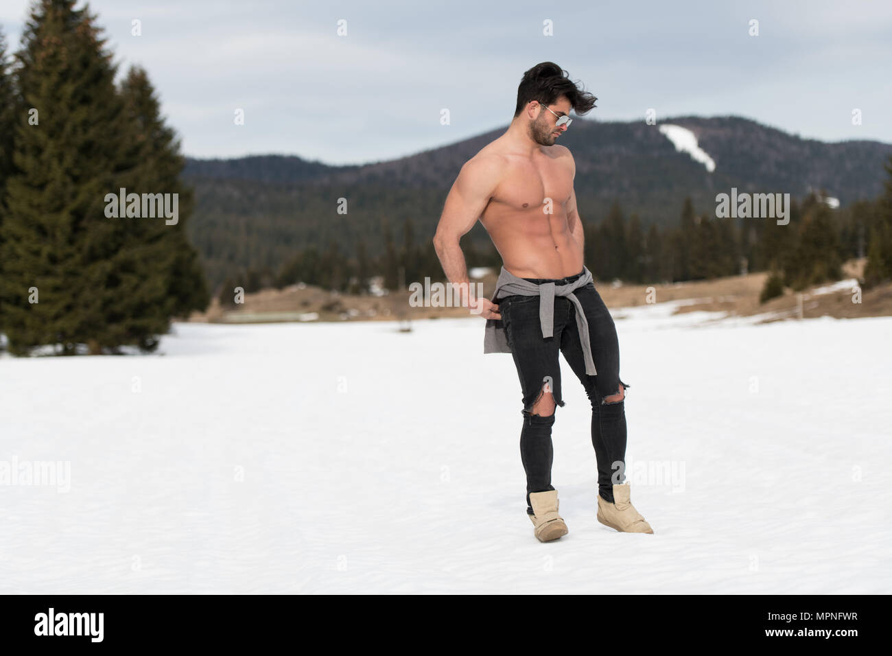 Portrait of a Young Physically Fit Man Showing His Well Trained Body ...