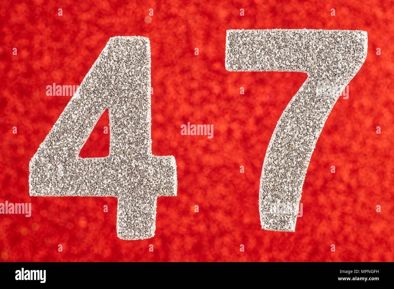Number forty-seven silver color over a red background. Anniversary ...